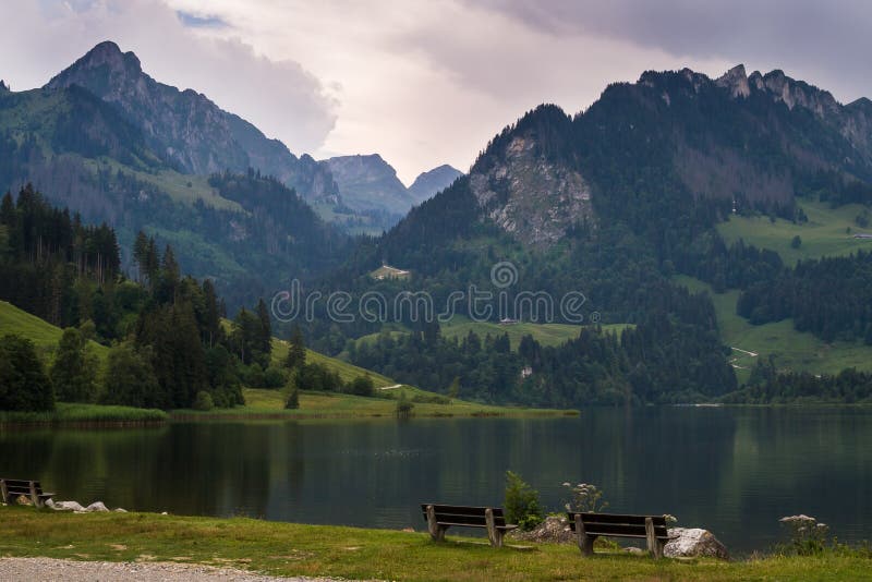 Alp view with lake stock photo. Image of peak, landscape - 67196966