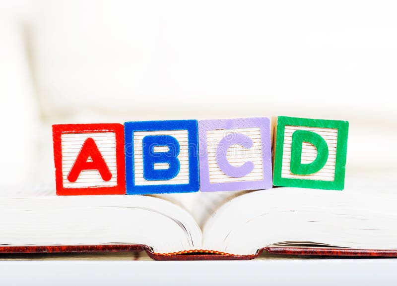 Alphabet Block with ABCD on Book Stock Image - Image of game ...
