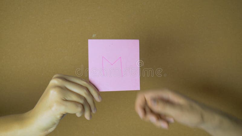 Alphabet in Motion. Hands Passing Each Other Sticky Notes with Letters ...