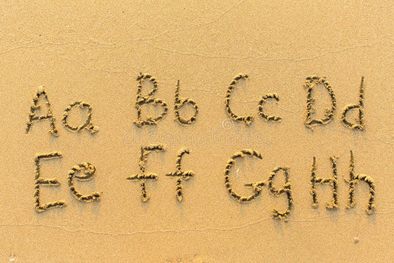 Alphabet Written by Hand on Sandy Beach Stock Photo - Image of case ...