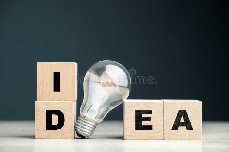 Idea Topic with Glowing Light Bulb Stock Photo - Image of blocks ...