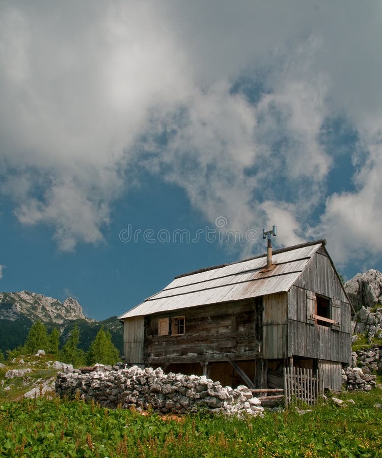 Alpine Cottage in the Mountains Stock Image - Image of grass, julian ...