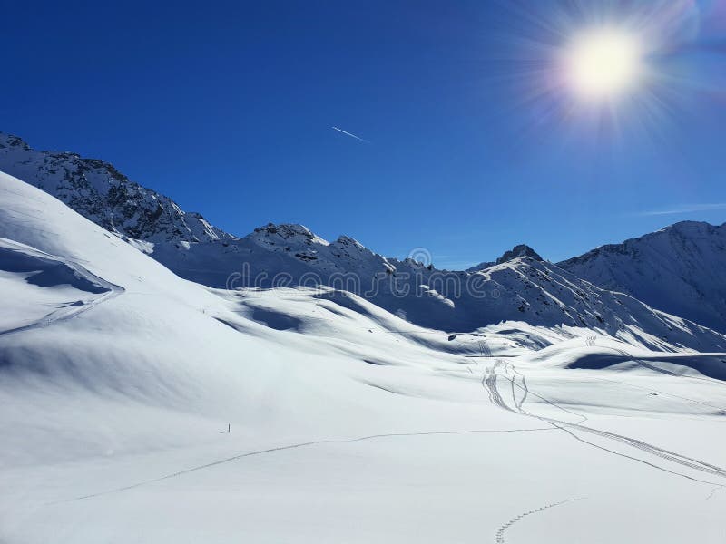 Alpine French Ski Slopes Under Blue Ski Stock Photo - Image of alps ...