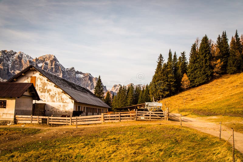 Alpine hut with a bench stock image. Image of alps, italy - 151878253