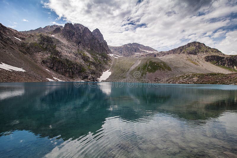 Alpine Lake among the Rocks Stock Photo - Image of peak, alpinism: 95109190
