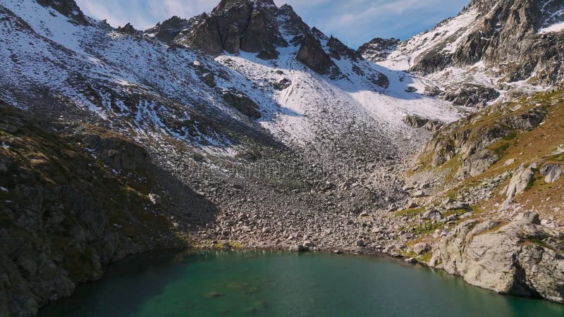 Alpine Lake Surrounded by Sharp Rocks. Steep Mountain Peaks. Primary ...