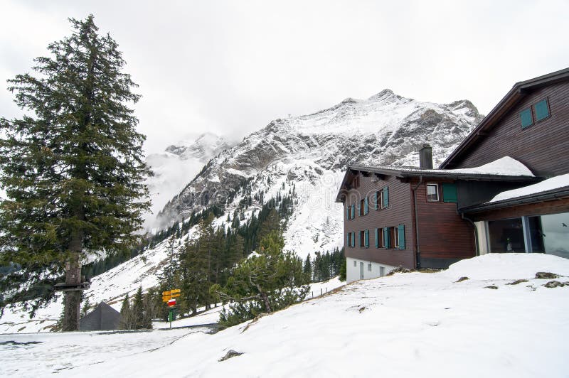 Alpine lodge in the winter stock image. Image of tourism - 206146529