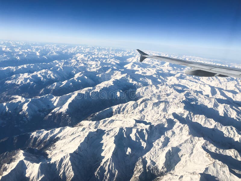 Alpine Mountain Range Covered with Snow Stock Image - Image of wing ...