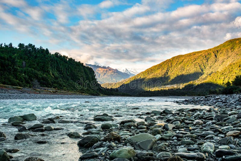 A River Flowing Down the Valley from the the Peaks of Southern Alps ...