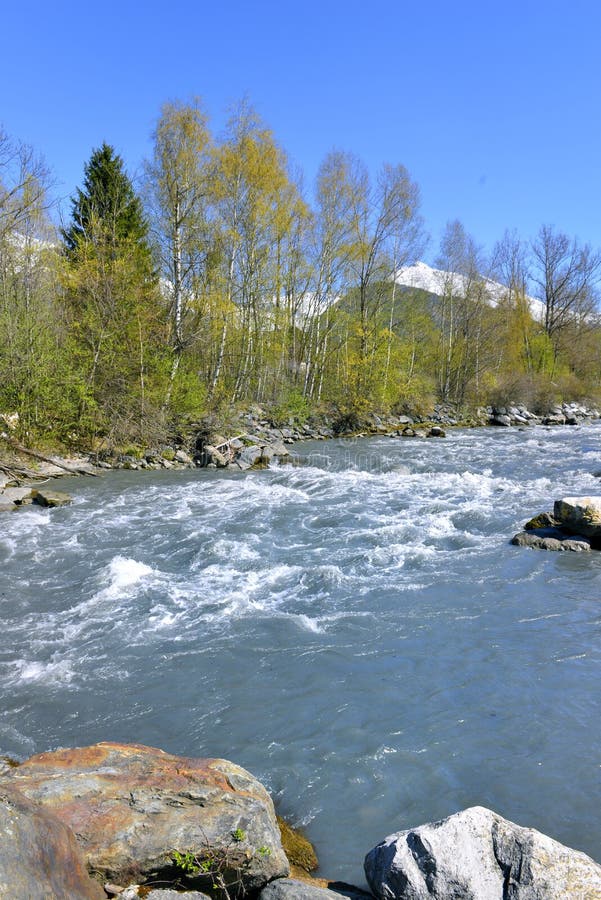 Alpine River Flowing in Spring Stock Image - Image of blue, savoy ...