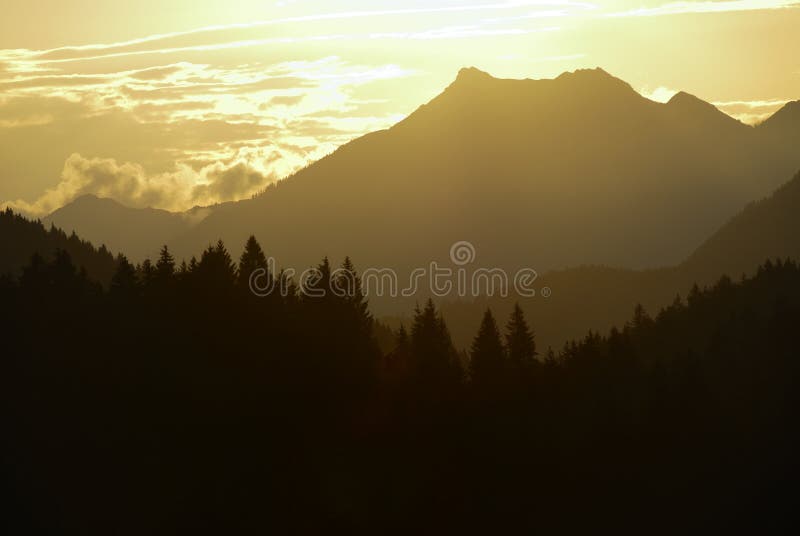 Alpine sunset stock photo. Image of silhouette, idyll - 12415528