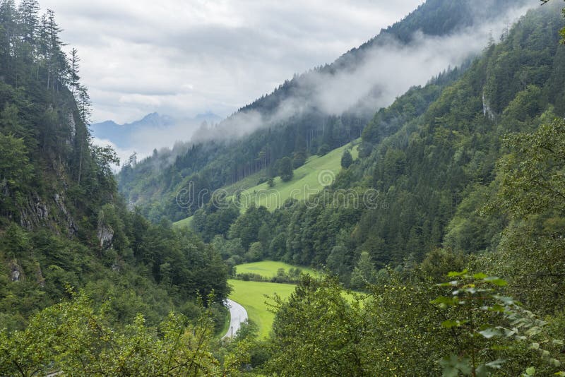 Alpine Valley after Rain with the Clouds Raising Stock Photo - Image of ...