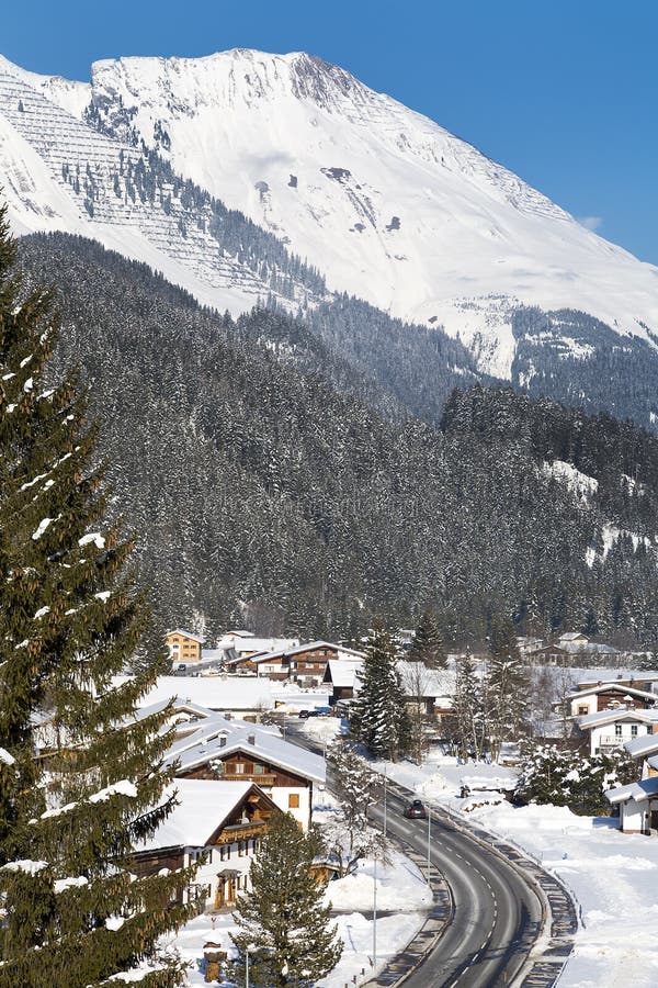 Alpine village in the snow stock image. Image of mountainous - 55791849