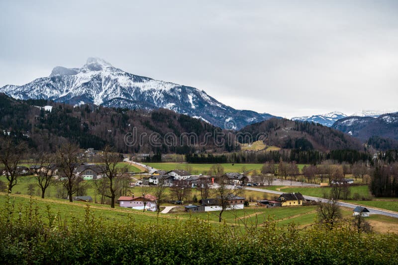 Alpine Village Under the Hills Stock Photo - Image of grassland, swiss ...