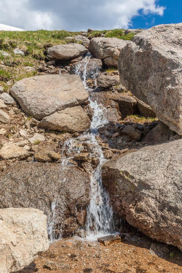 Alpine Waterfall stock image. Image of flowing, mountain - 84884647