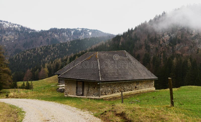 Alps Cottage in April in Rainy Day Editorial Photography - Image of ...