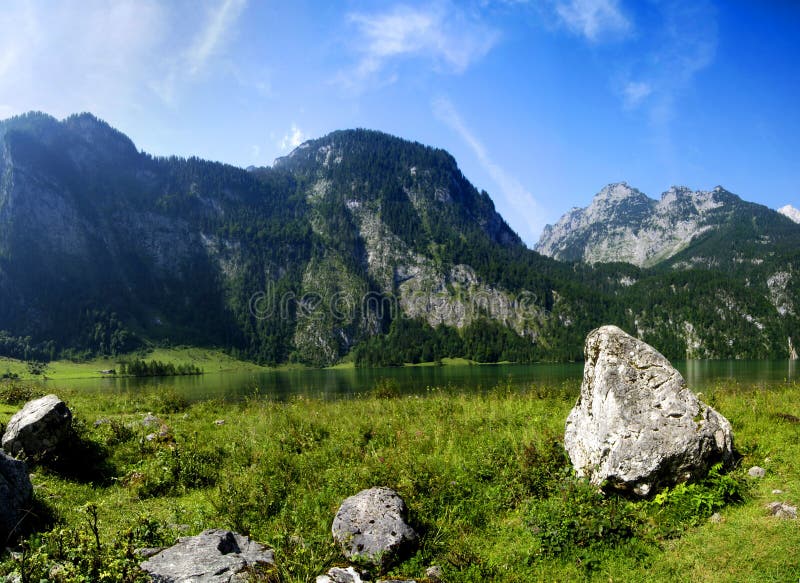 Alps and lake stock photo. Image of grass, rocks, lake - 11599110