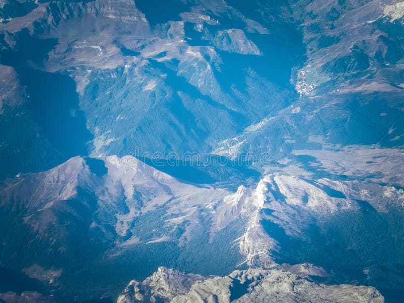 Alps from plane window stock image. Image of bending - 265105913