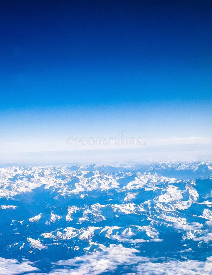 The Alps Seen from an Airplane Window Stock Image - Image of gray ...