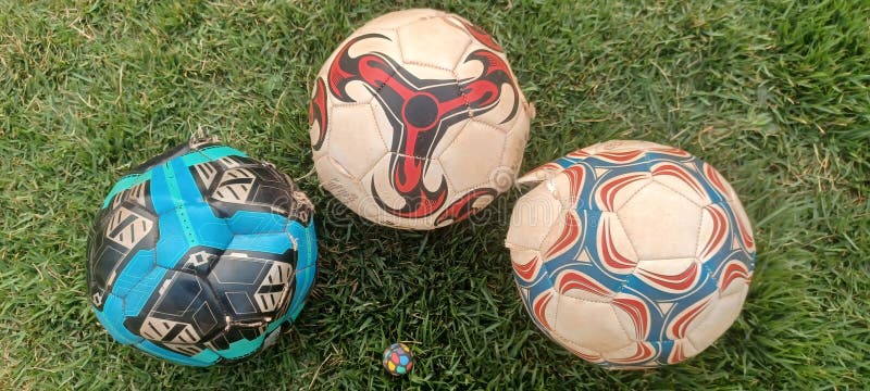Already Well-worn Balls Rest on the Green Grass Stock Photo - Image of ...