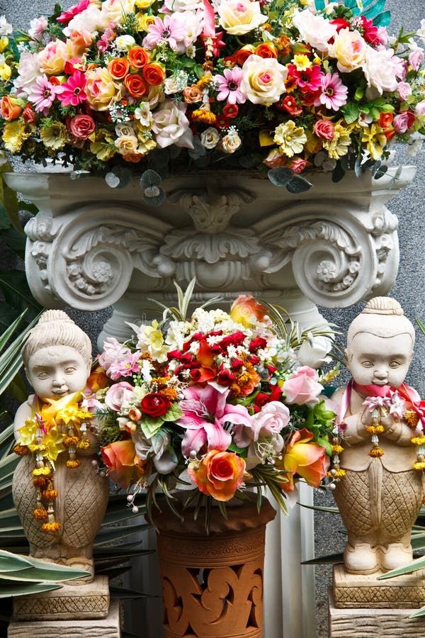 Altar flowers and statues. stock photo. Image of beautiful - 22759920