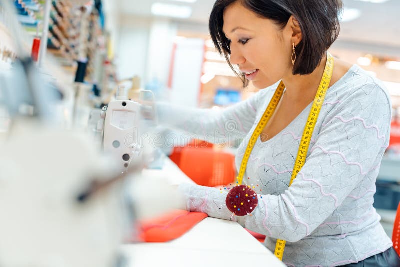 Seamstress Working in Her Studio Sewing Clothes Stock Image - Image of ...