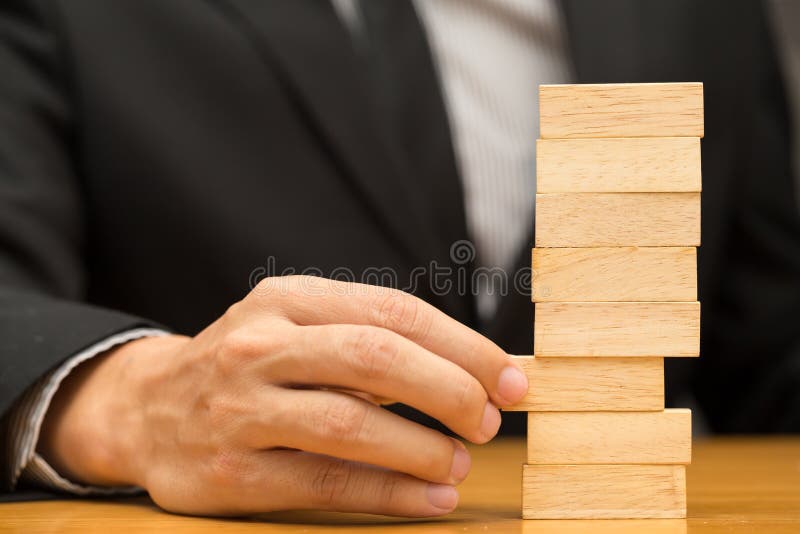 Alternative Risk Concept. Businessman Choosing the Wood Block Stock ...