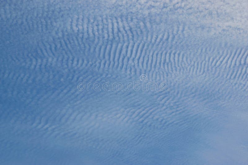 Altocumulus Radiatus Clouds in a Blue Sky. Background, Screensaver ...