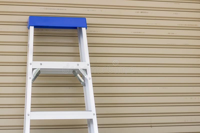 An Aluminum Foldable Ladder on the Wall Stock Image - Image of ...
