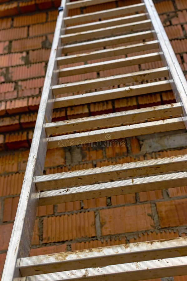 Aluminum Ladder at the Construction Site Against the Background of a ...