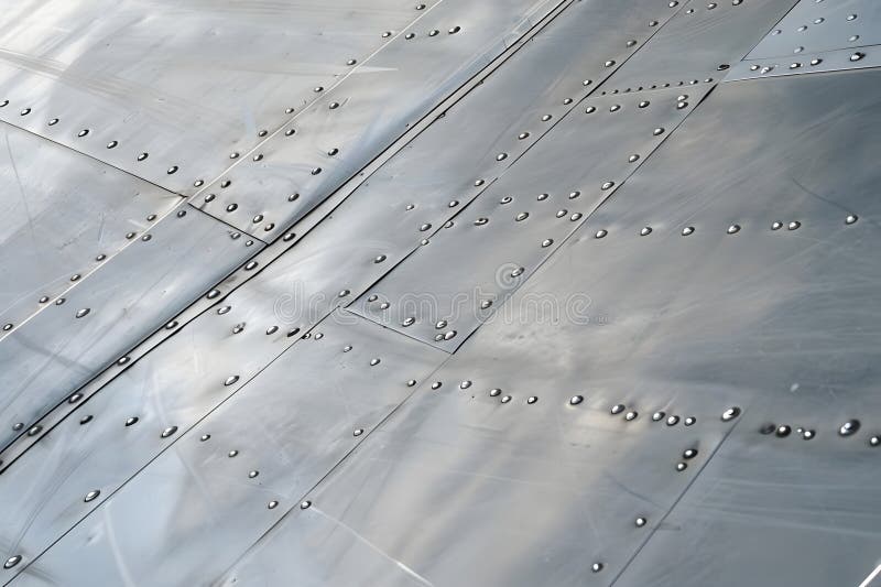 Aluminum Paneling, Rivets Secure Metal Sheets in Geometric Patterns ...