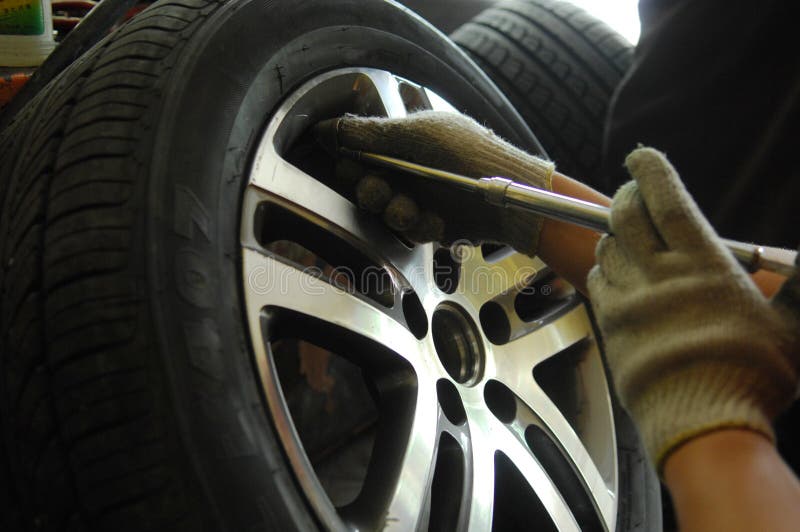 Wheel change stock photo. Image of engineer, wheel, male - 6171916