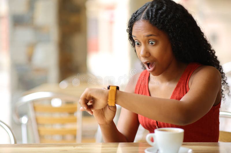 Amazed Black Woman Checking Smartwatch in a Bar Stock Image - Image of ...