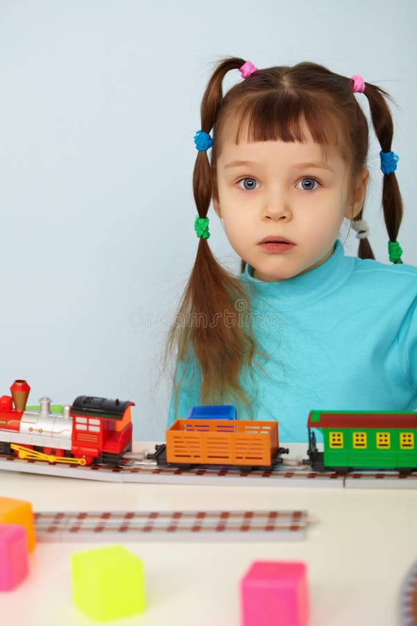 Amazed Child and Toy Railway Stock Photo - Image of table, surprised ...