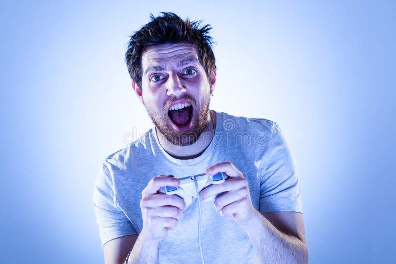 Amazed Man with Gamepad stock photo. Image of happy, young - 24982942