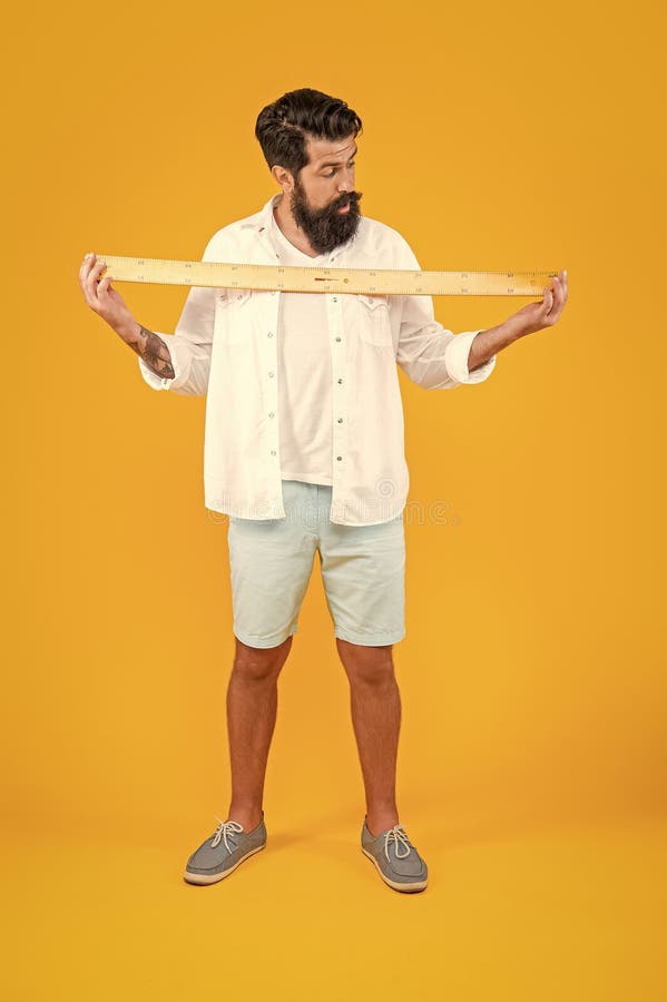 Amazed Man Hold School Ruler on Background. Photo of Man Hold School ...