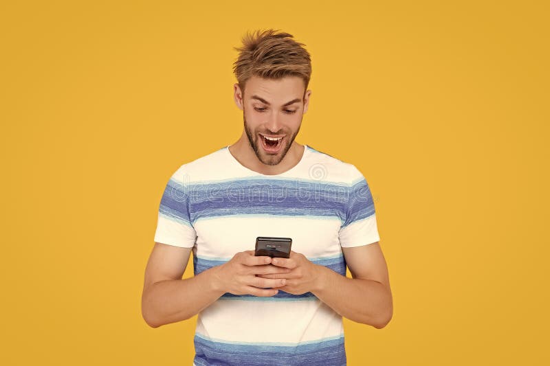 Amazed Man Uses Phone To Make Effective Communication. Man Has Phone ...