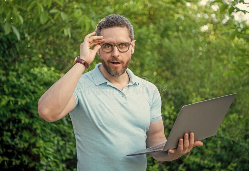 Amazed Programmer Man Online Outdoor. Programmer Man Working Online on ...