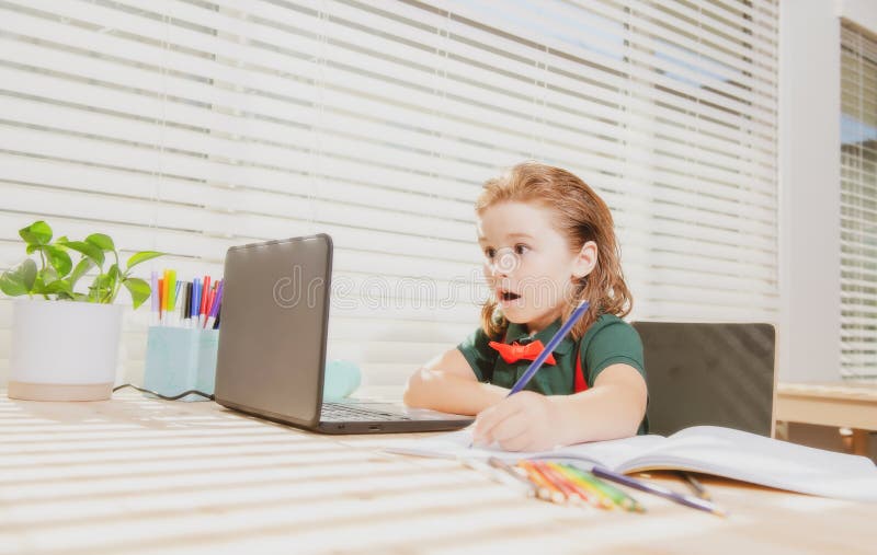 Amazed School Boy Pupil Does Homework in School Class. Writes Text from ...