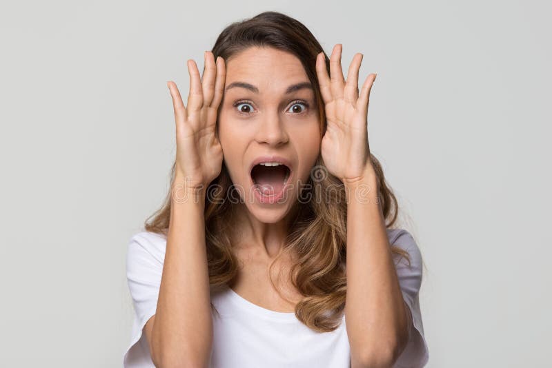 Amazed Funny Young Woman With Surprised Face Looking At Camera Stock