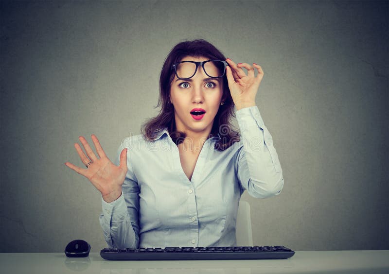 Amazed Woman Working on Computer with Keyboard Looking in Surprise at ...