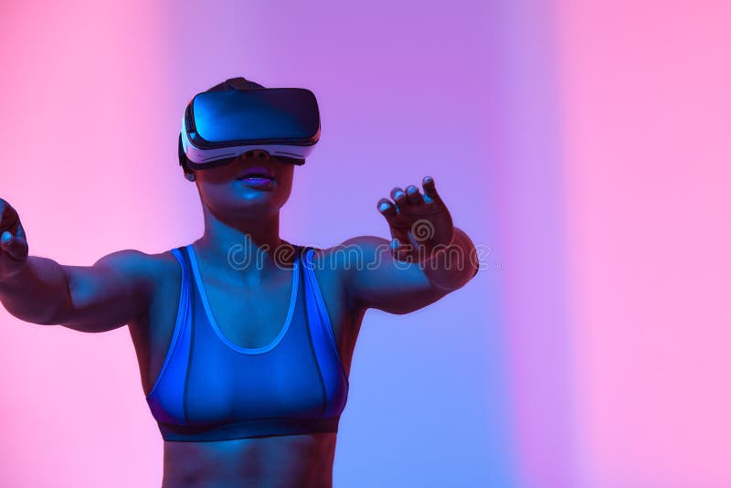 Amazed Young Woman Touching the Air during the VR Experience ...
