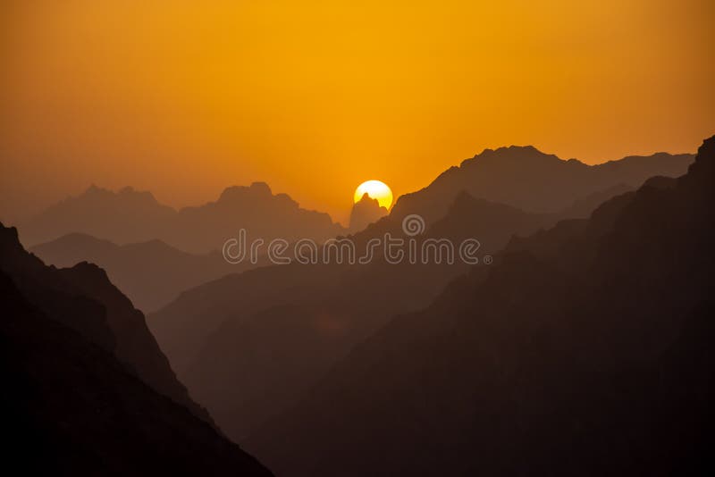 Amazinag Sunset Behind Mountains Stock Photo - Image of nature, light ...