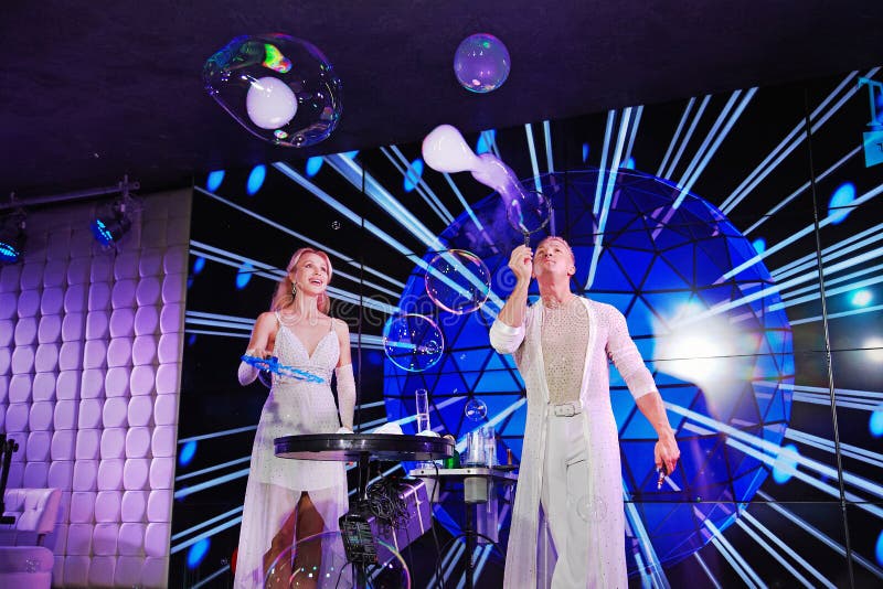 Amazing Bubble Show Performance with Two Artists, Lights, Smoke Stock ...