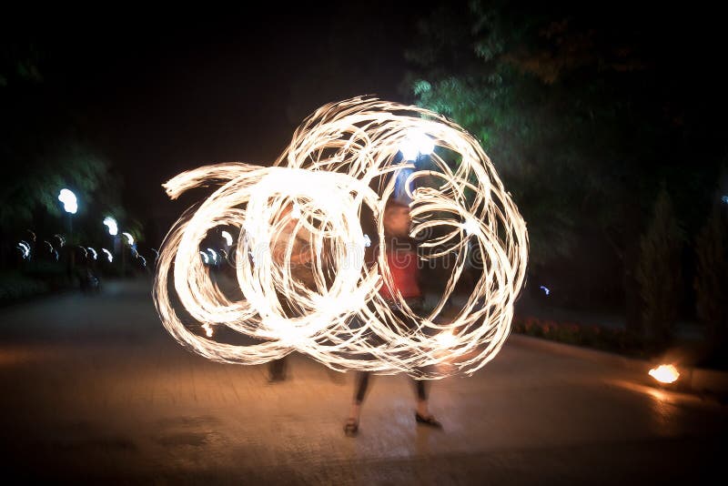 Amazing Fire Show Dance. Fire Dancers Playing with Flame Editorial ...