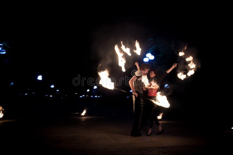 Amazing Fire Show Dance. Fire Dancers Playing with Flame Editorial ...