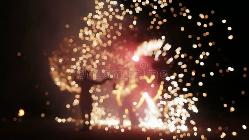 An Amazing Fire Show at Night. a Woman Spinning Fire. Back View of ...