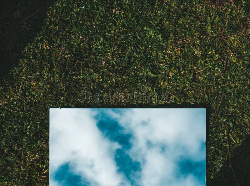Amazing Flat Lay of a Mirror on the Grass Stock Photo - Image of light ...