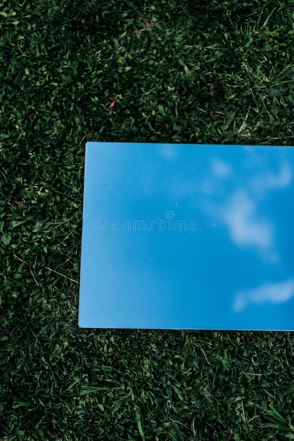 Amazing Flat Lay of a Mirror on the Grass Stock Image - Image of ...