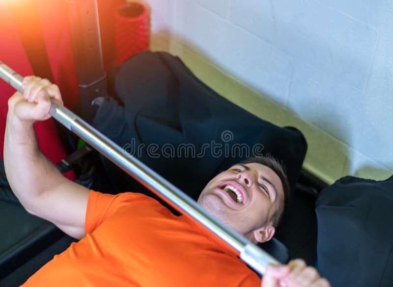 Amazing Image of a Young Man Doing Bench Press Stock Photo - Image of ...